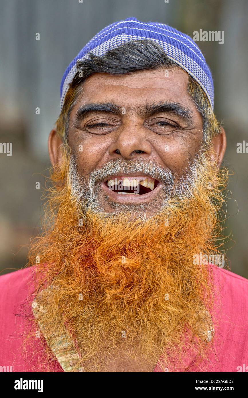 A man in Srinagar, Bangladesh. He has used henna to dye his beard Stock ...