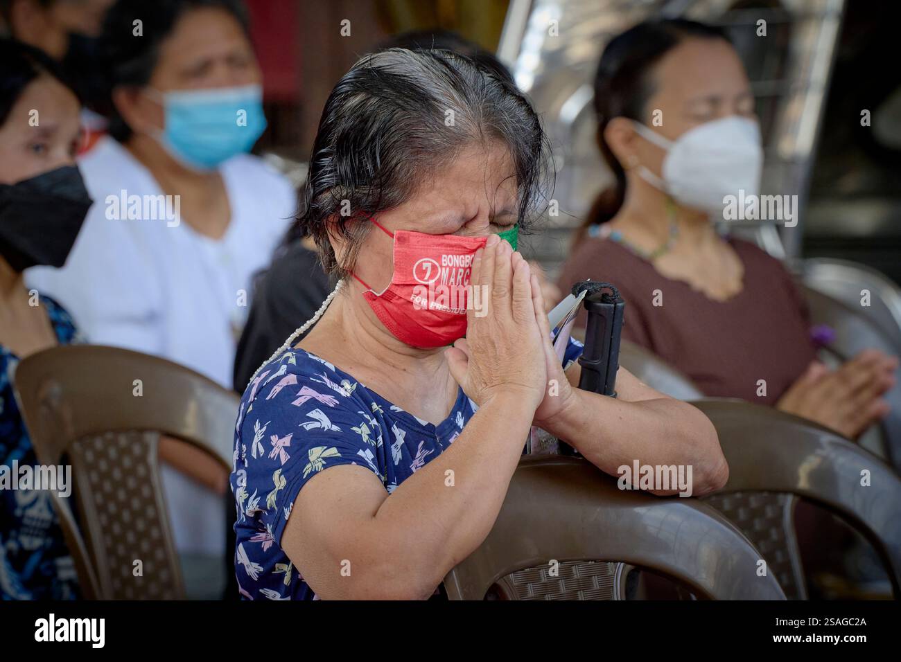 A woman wears a face mask supporting Ferdinand "Bongbong" Marcos, Jr ...