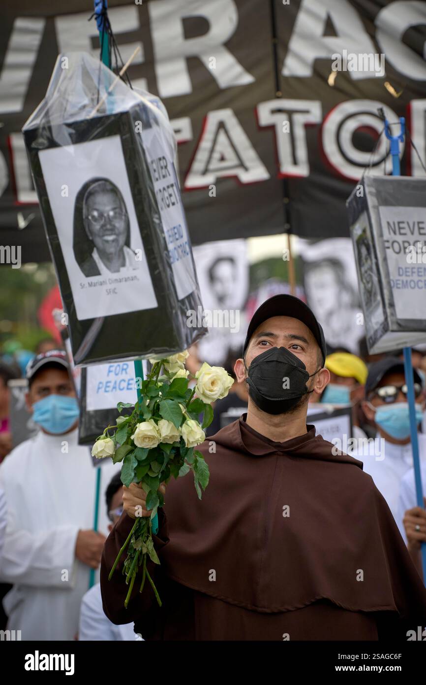 Church activists take to the streets of Manila on September 21, 2022 ...