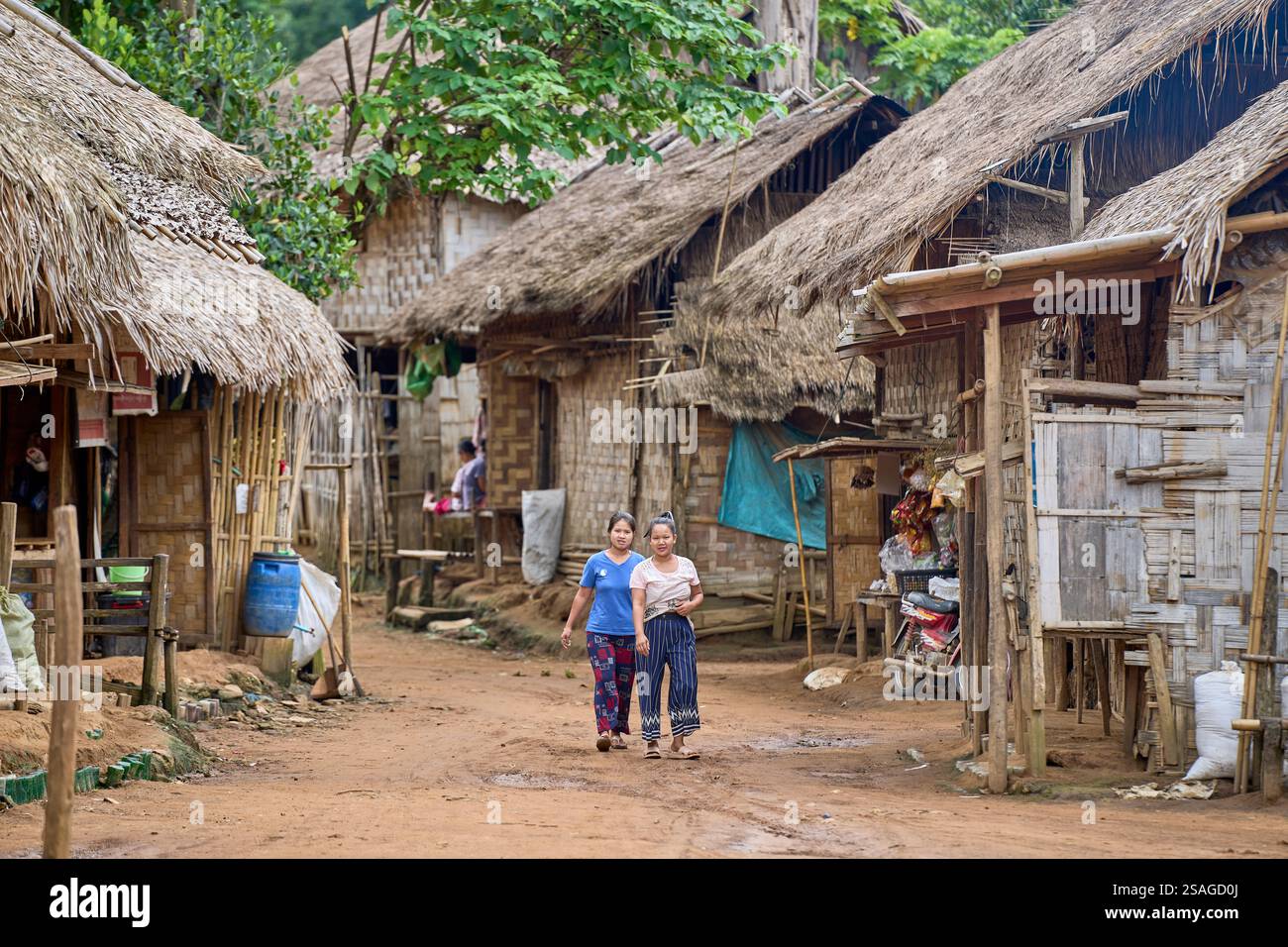 Girls walking in the Ban Mai Nai Soi refugee camp in Thailand. The camp ...