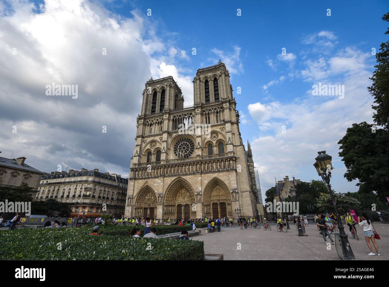 Notre-Dame Cathedral and the Vibrant Place Jean-Paul II on a Partly ...