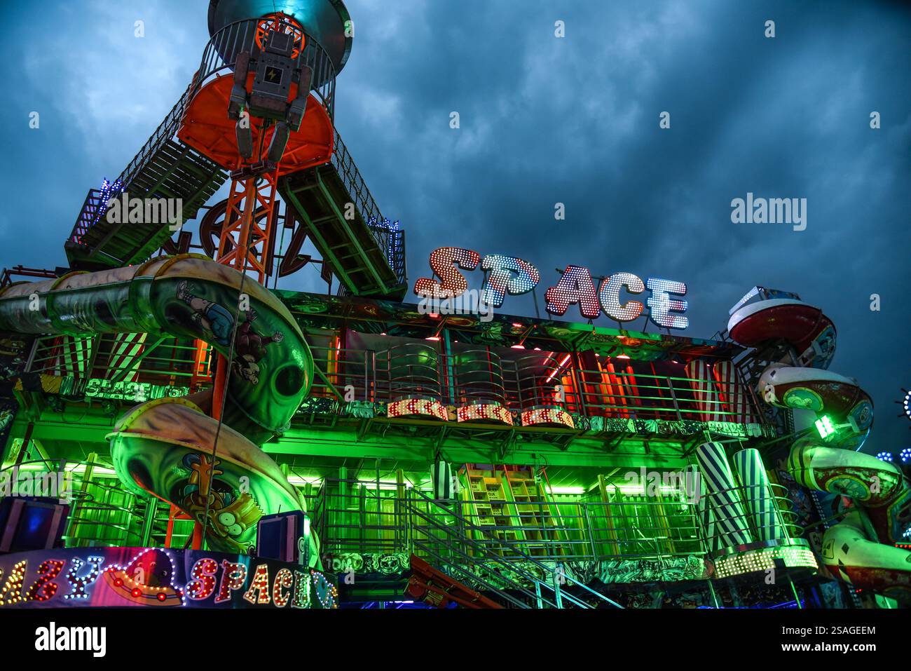 Neon Lights of the Space Ride at Jardin des Tuileries Funfair under ...