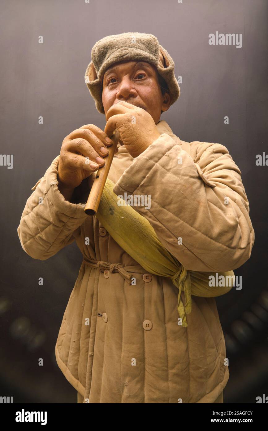 A diorama of a typical soldier with a recorder musical instrument. At ...