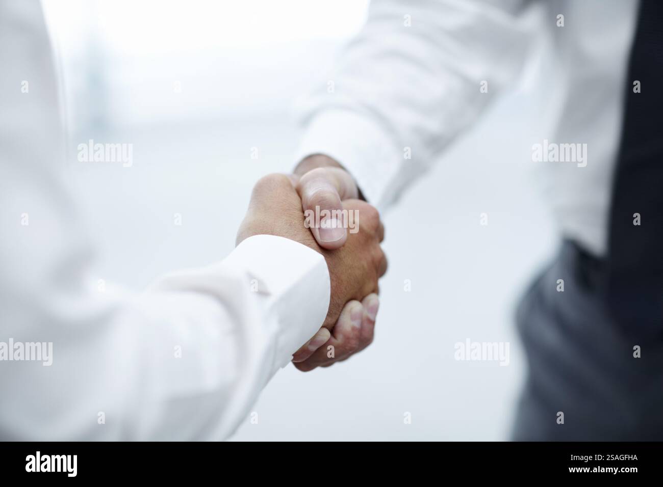 Closeup, meeting and business people with handshake for agreement ...