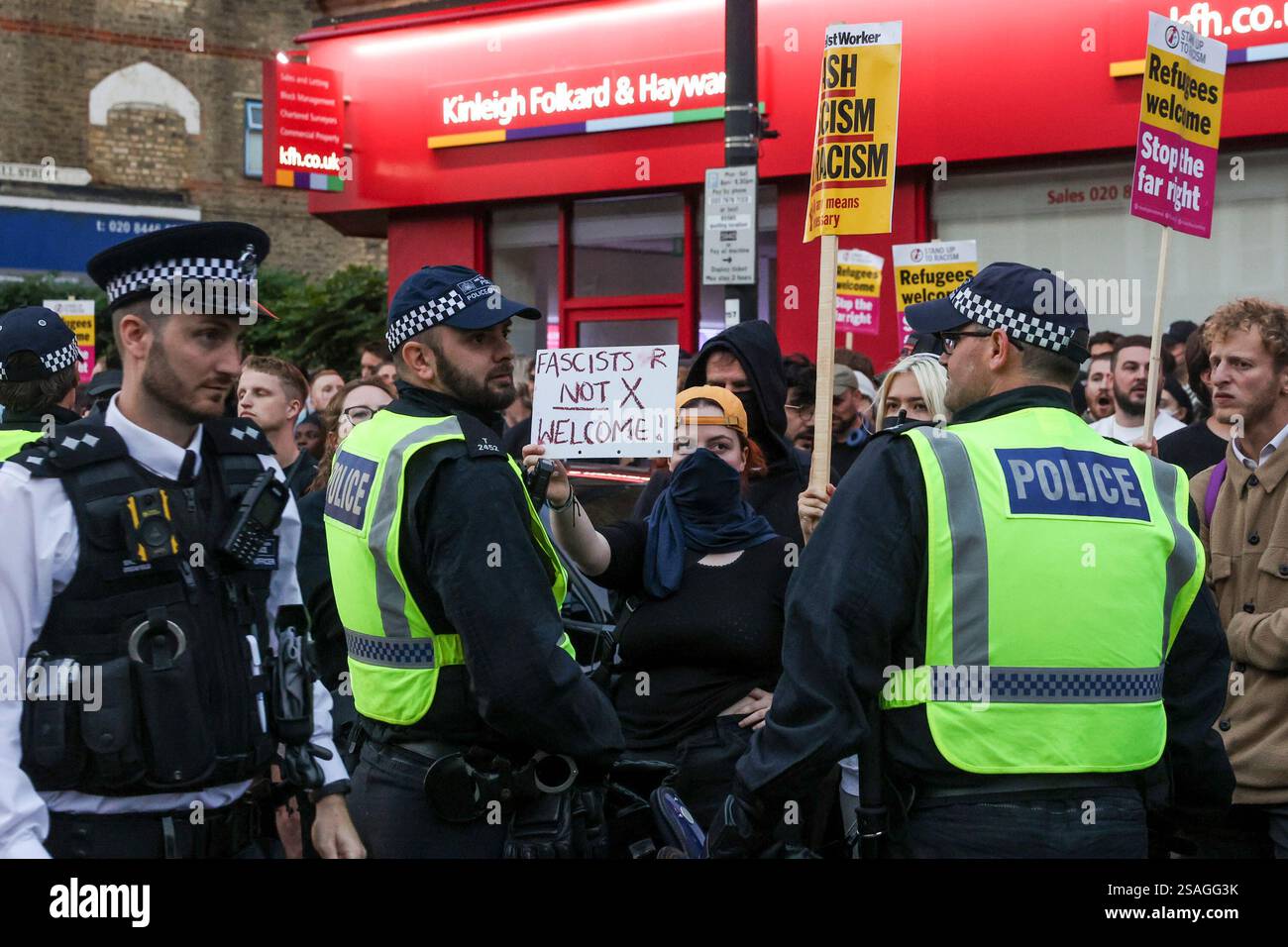 August 7, 2024, London, United Kingdom: Police hold back protestors as ...
