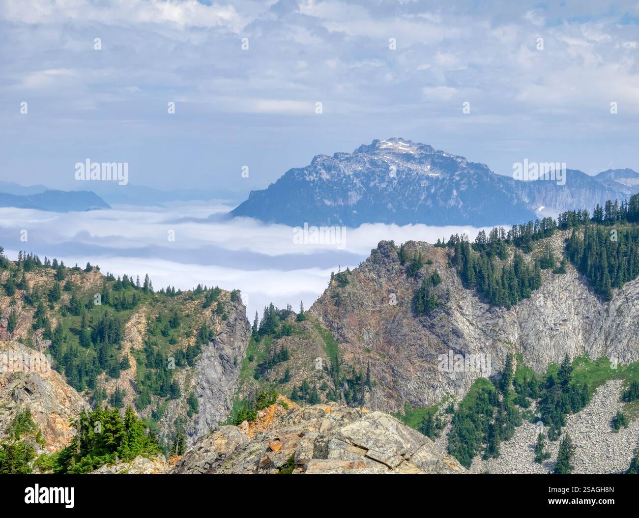 USA, Washington State. Central Cascades, Big Snow Mountain and low fog ...