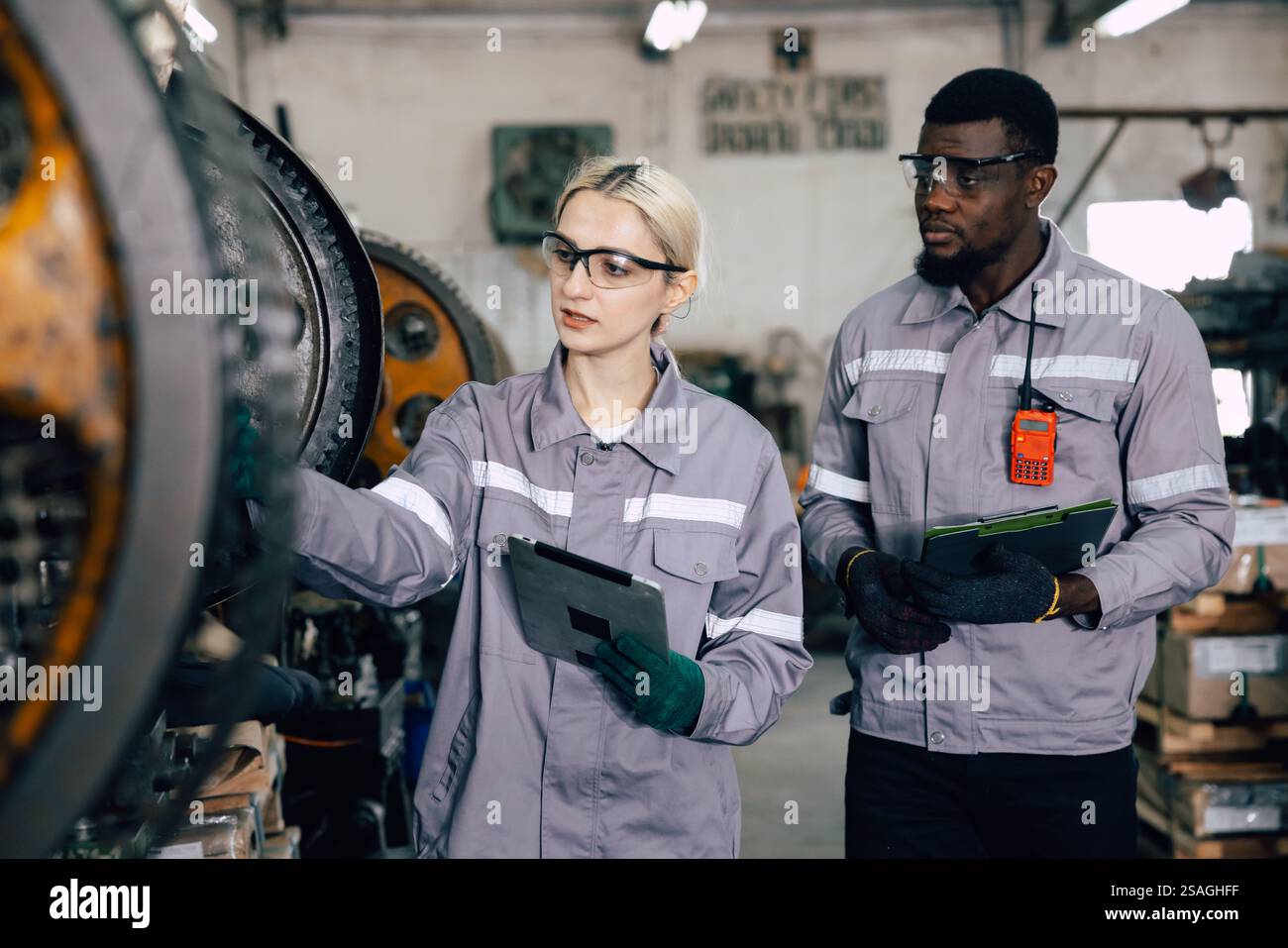 professional engineer officer team inspecting safety audit old machine in heavy industry factory ...