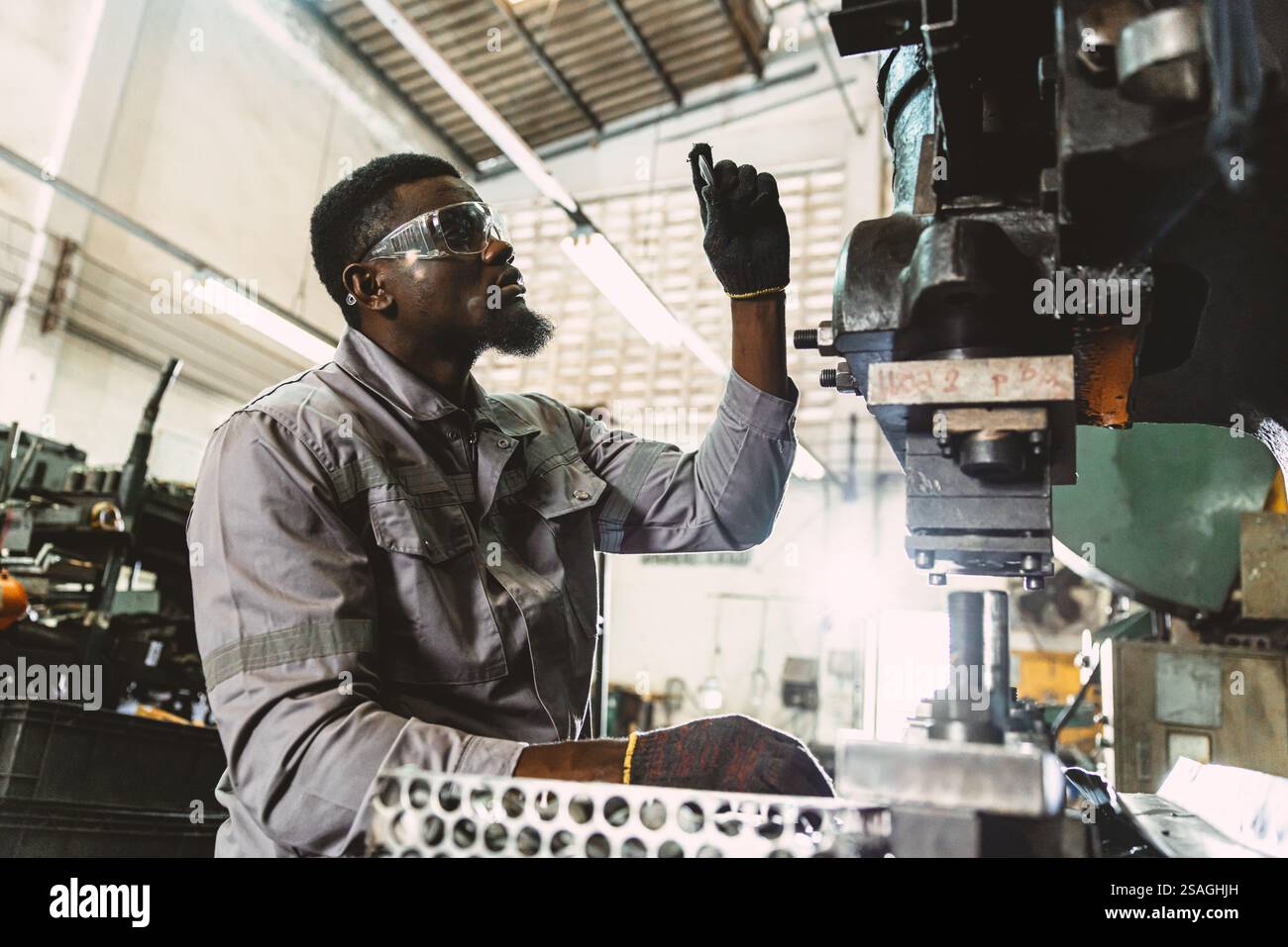 african black male worker working in heavy metal industry factory ...