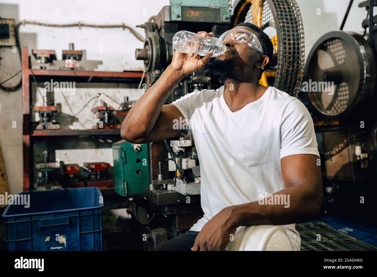 black male worker tired fatigue exhausted worker drinking water brake ...