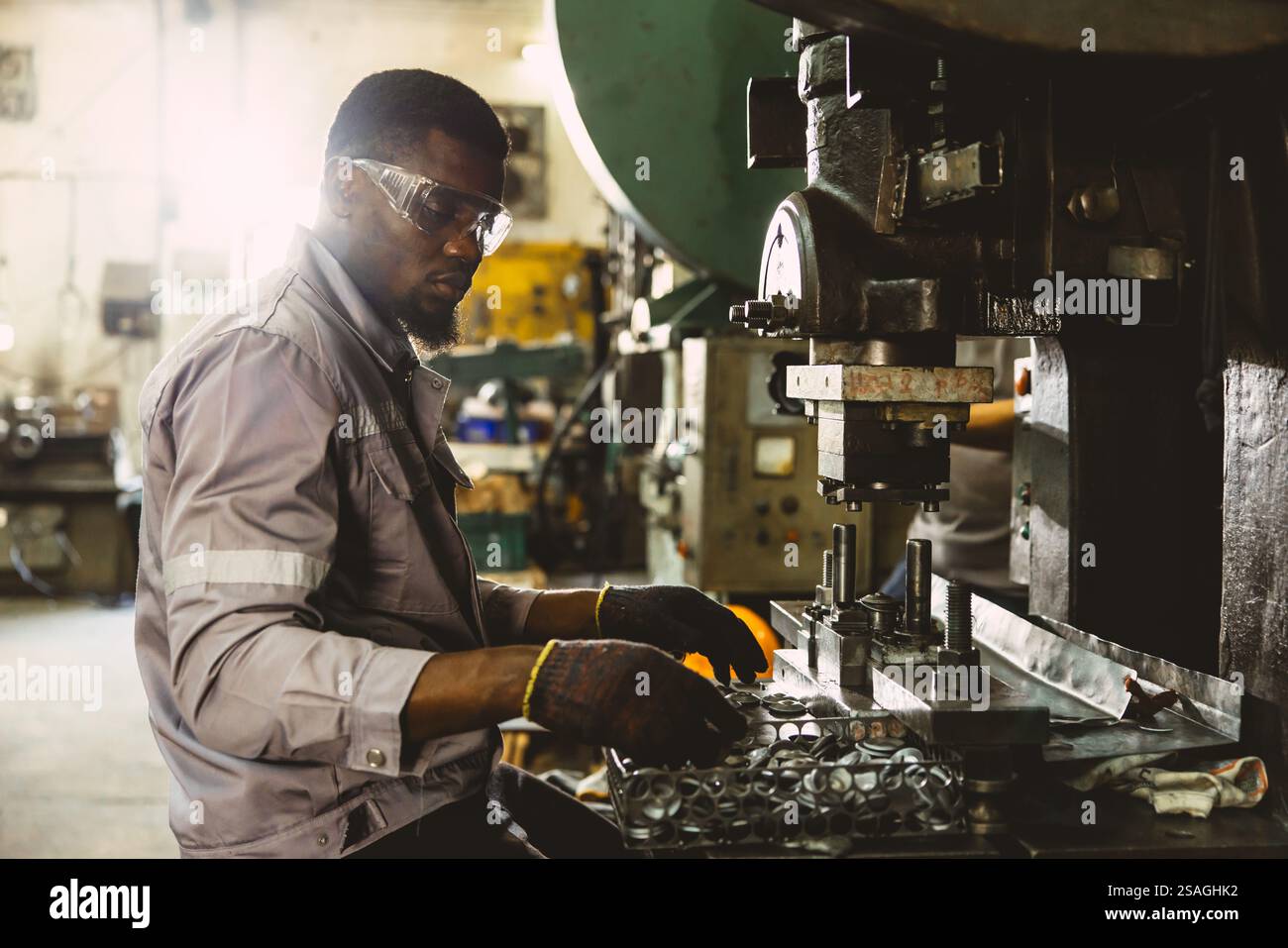 african black male worker working in heavy metal industry factory ...