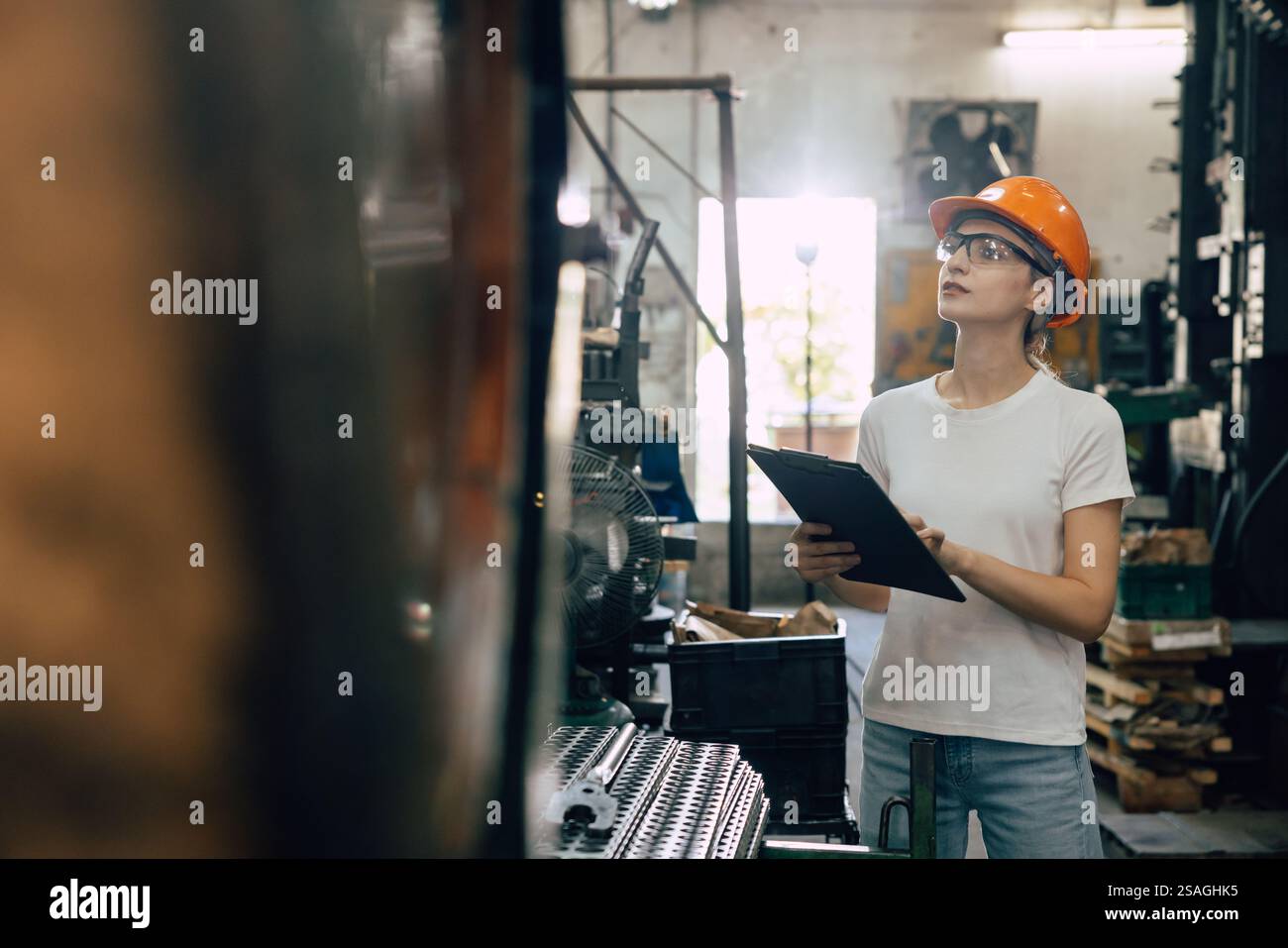 professional engineer caucasian women inspecting auditing old machine ...