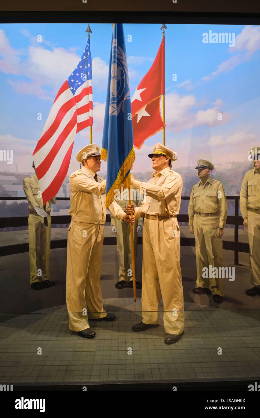A diorama of General Collins presenting a United Nations flag to ...
