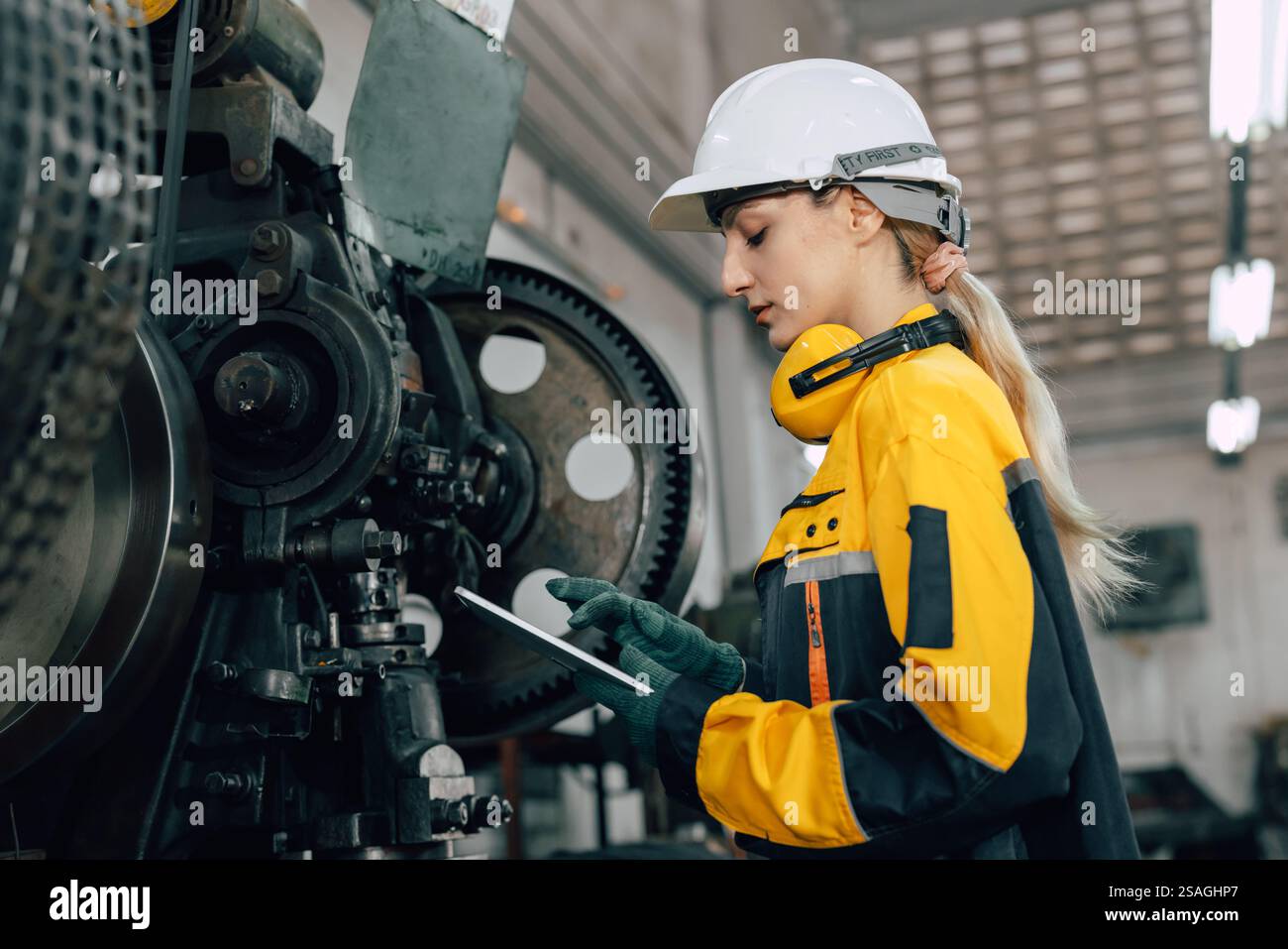 professional engineer caucasian women inspecting auditing old machine ...