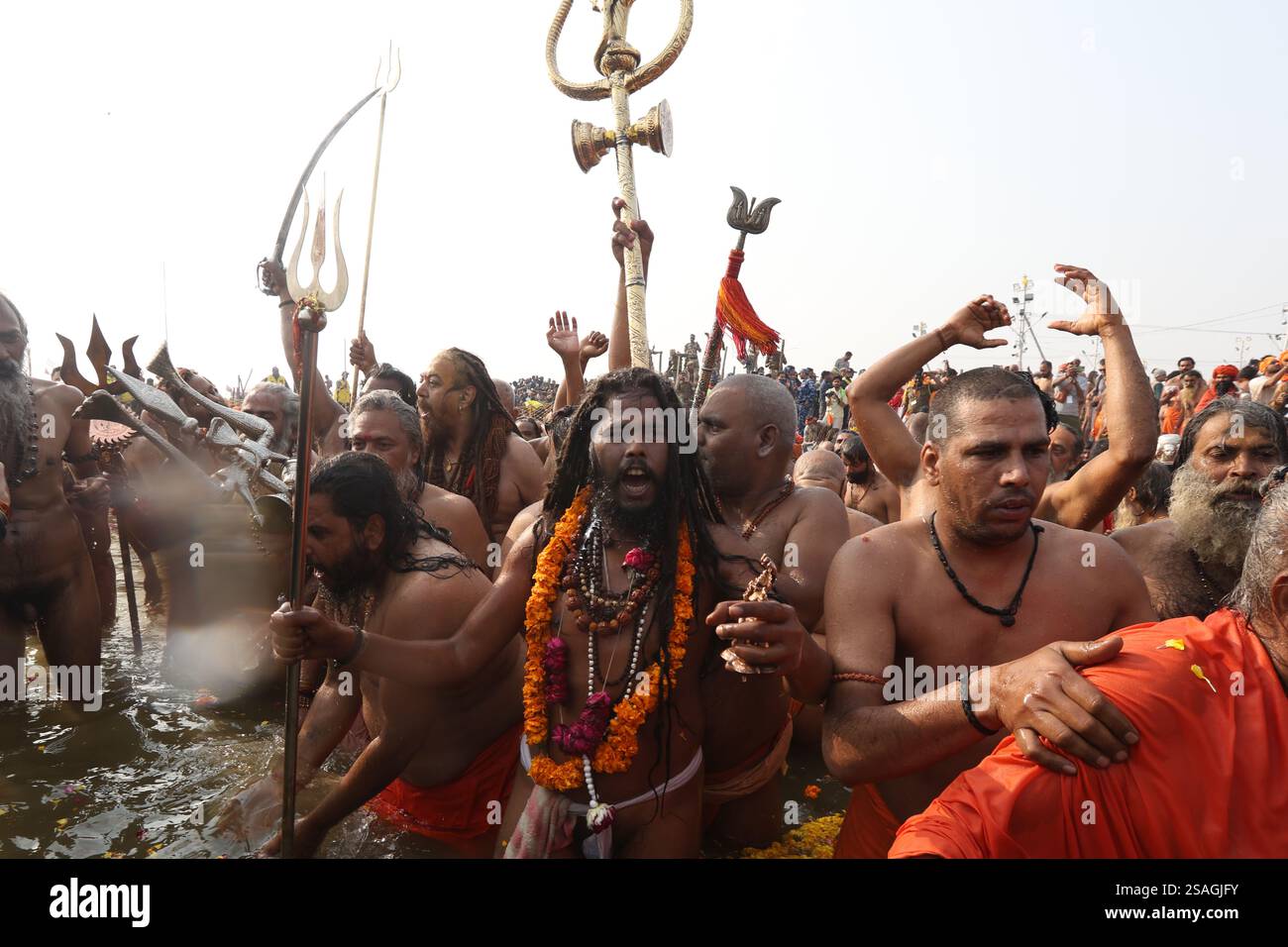 Holymen(Sadhus) take holy bath at the bank of Sangam on the occasion of ...