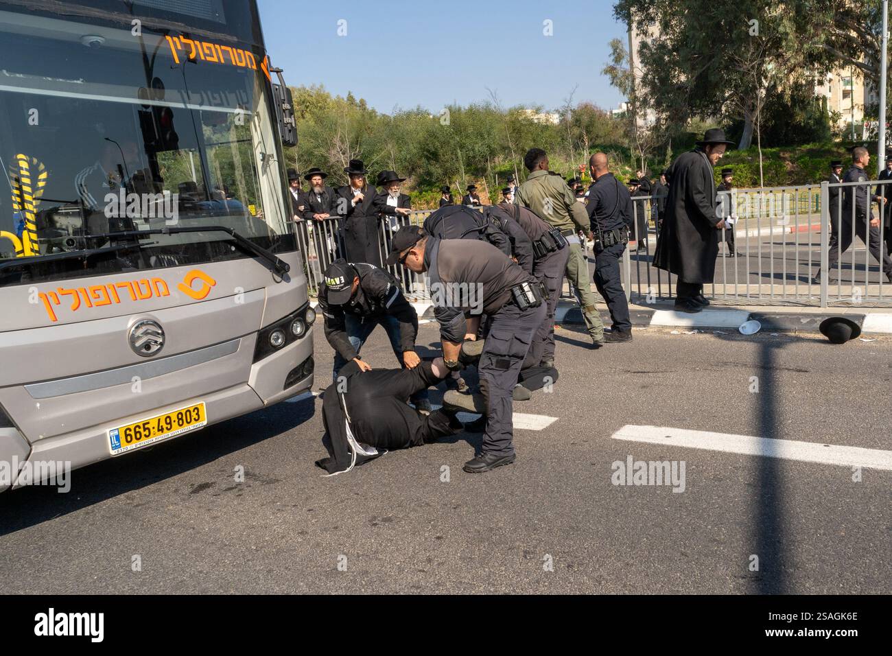 Protestors blocking the road preventing a bus to drive through during ...