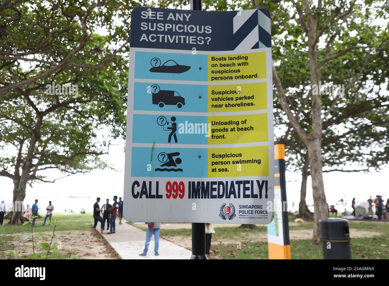 Sign in East Coast Park, Singapore advising people to report any ...