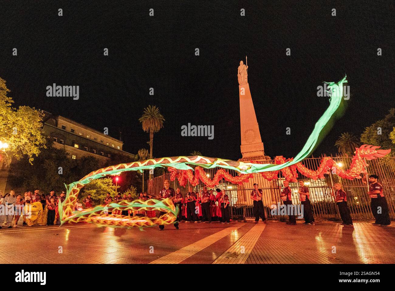 The snake dances in Plaza de Mayo while the dragon remains still behind ...