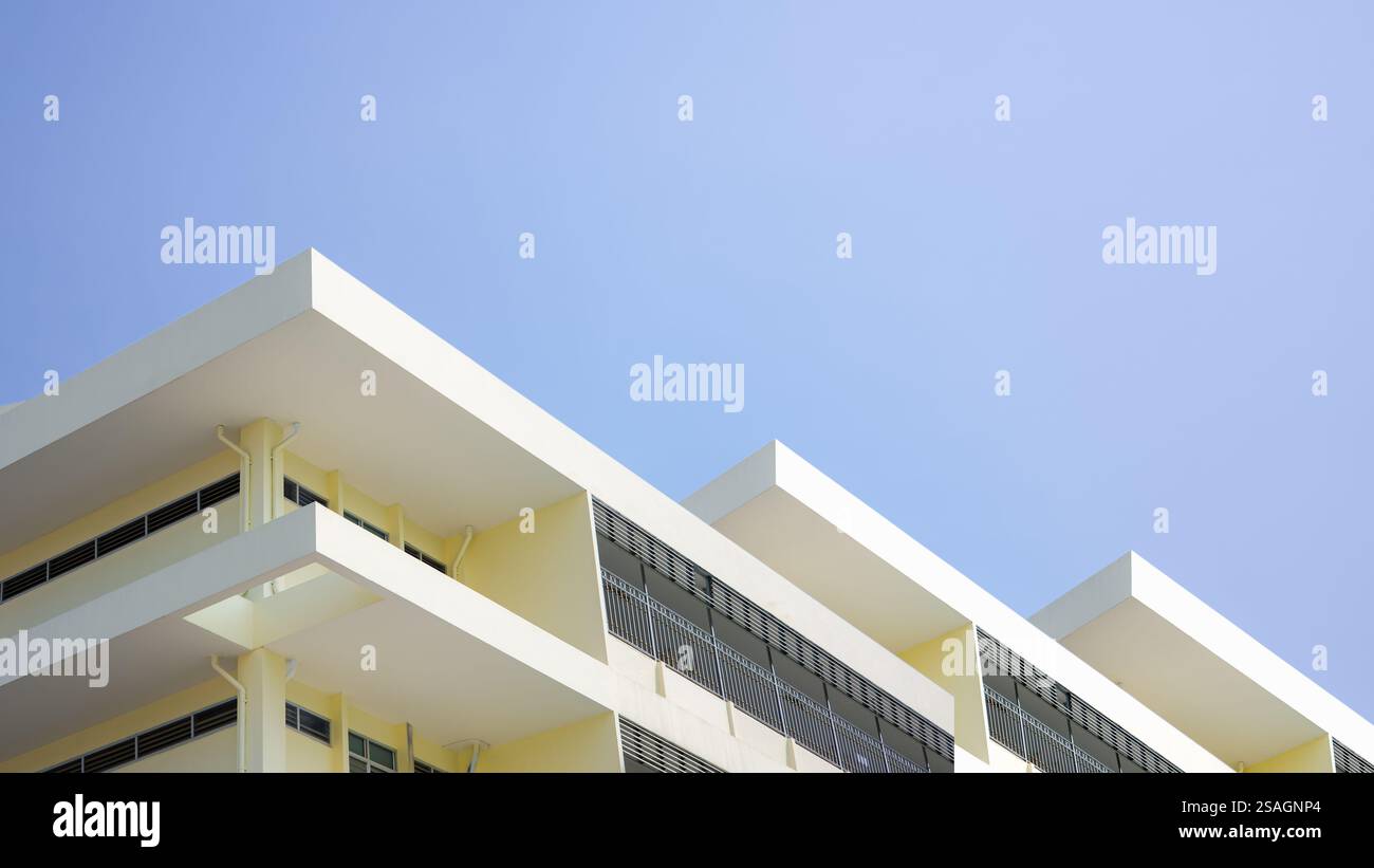 Light yellow building exterior on blue sky background, Modern Light ...