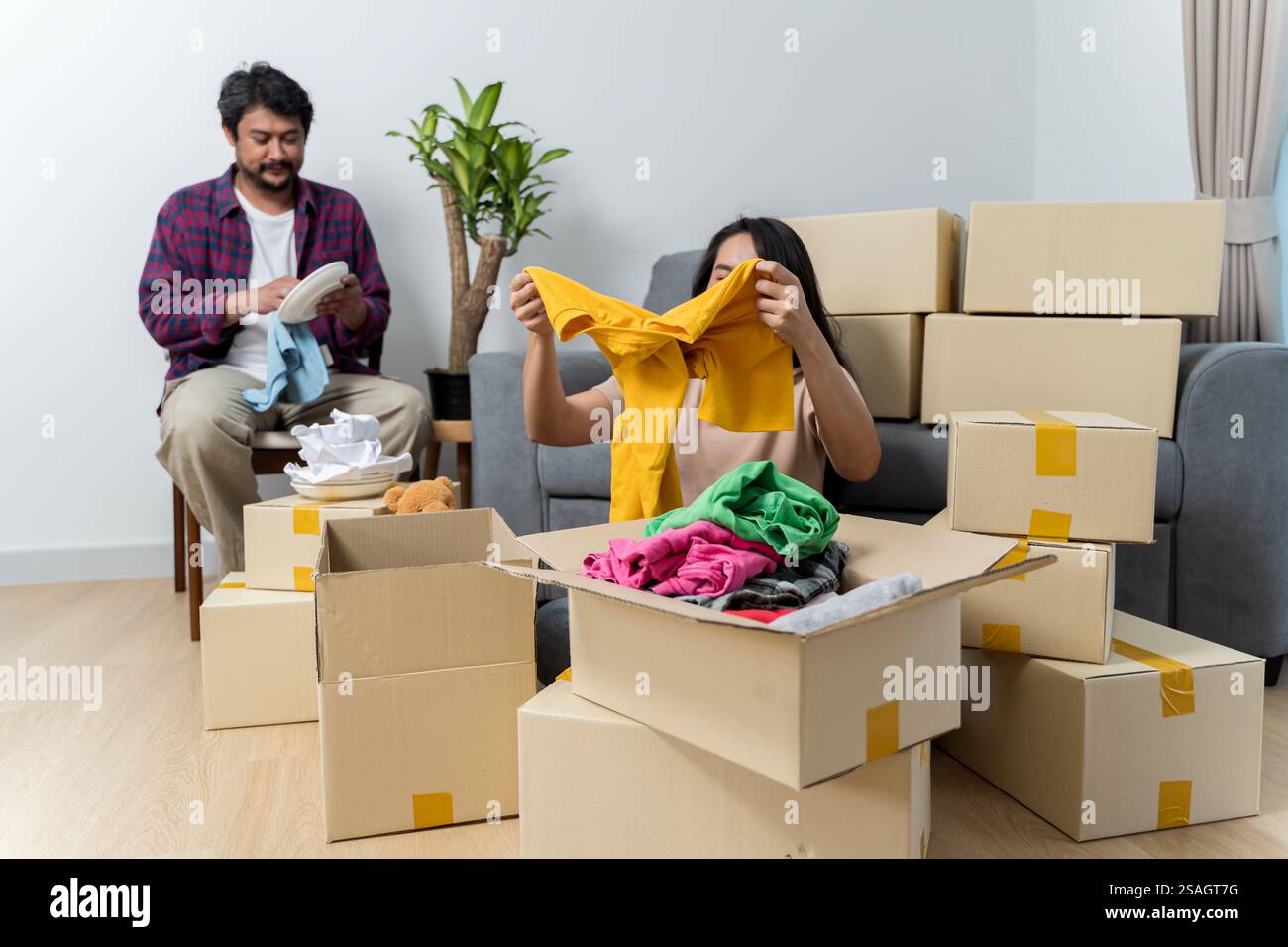 Relocation day. Happy young family couple renters tenants engaged in ...