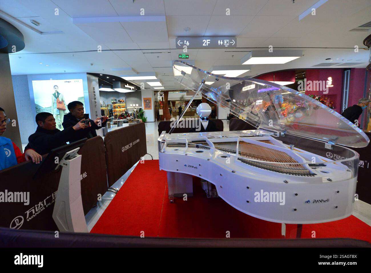 BEIJING, CHINA - JANUARY 30, 2025 - Visitors look at robots at the AI ...