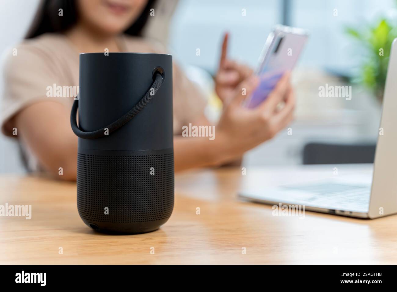 Closeup of smart portable wireless speaker on the table. Portable ...