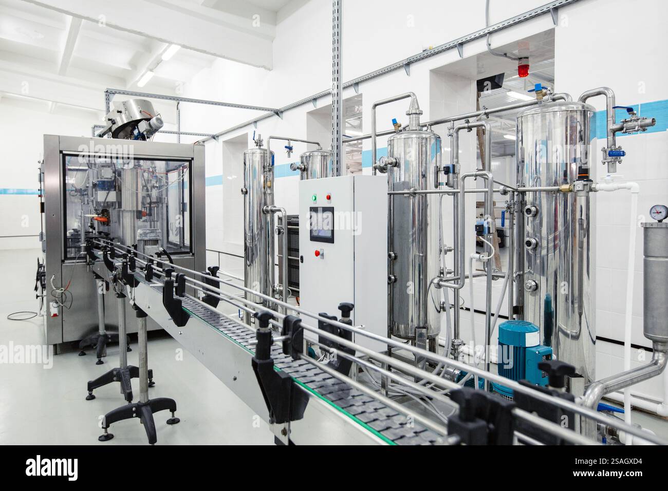 Modern processing line featuring stainless steel machinery in a clean ...