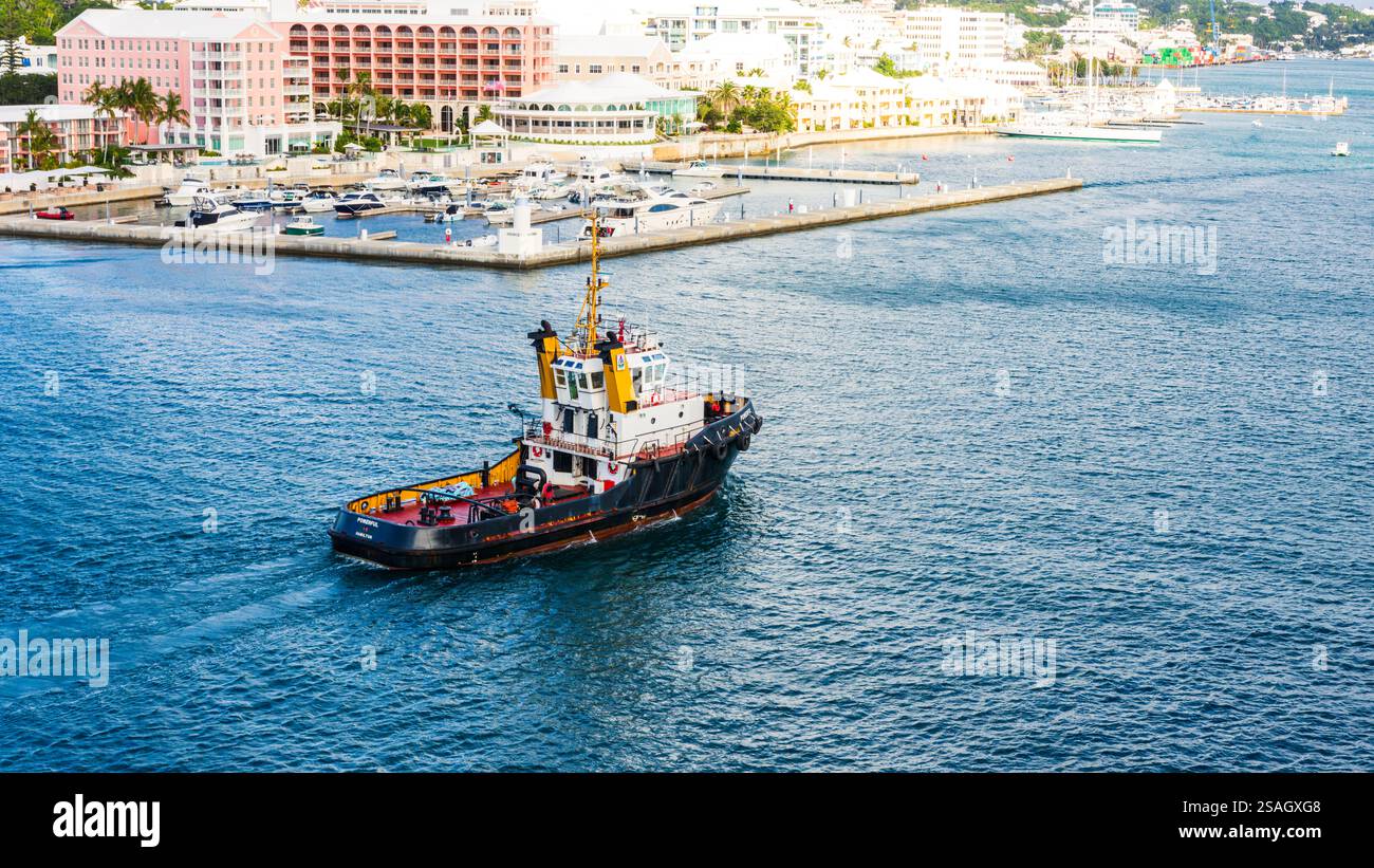 Tug boat in the Hamilton Harbor helping cruise ship to dock Stock Photo ...
