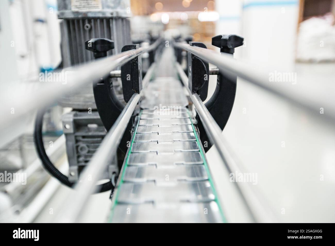 Industrial conveyor system in operation at a manufacturing facility ...