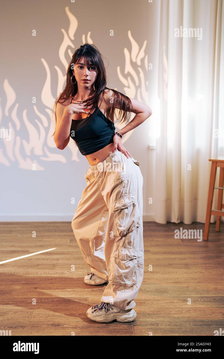 Dancer performs dynamic choreography in a modern studio with artistic ...