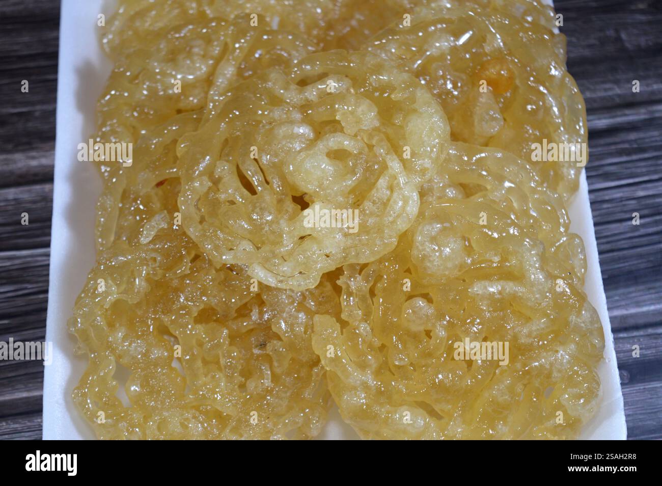 Egyptian Meshabek, a rounded sweet made of a deep-fried crunchy batter ...