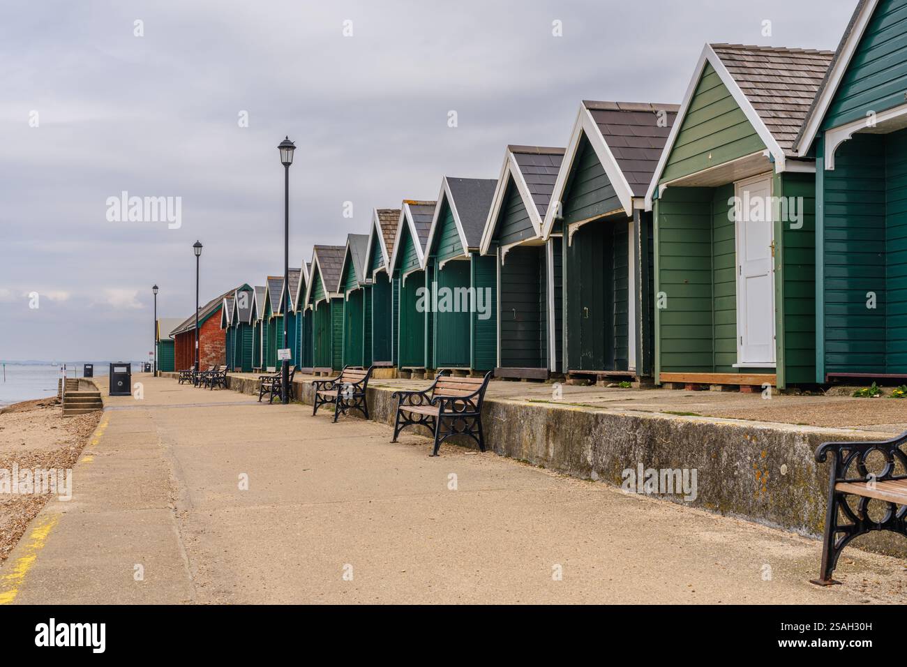 Beach huts at Gurnard Bay on the Solent coast, Isle of Wight, England ...