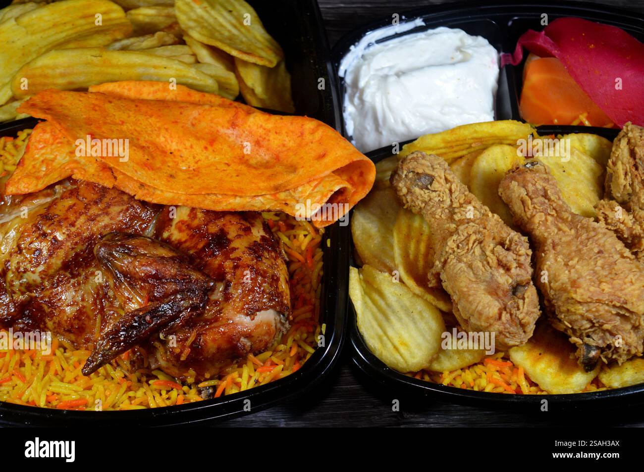 Syrian food of machine grilled barbecued chicken with colorful Basmati ...