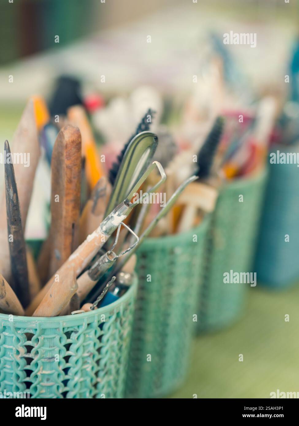 Tools in the pottery studio. Stacks, scallops, brushes. Devices for ...