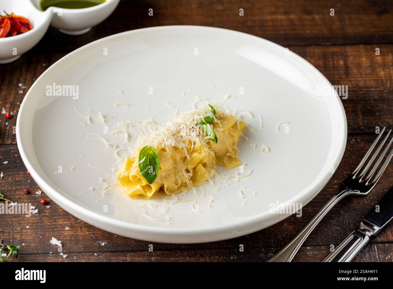 Delicious Italian pasta pappardelle with parmesan in white porcelain ...