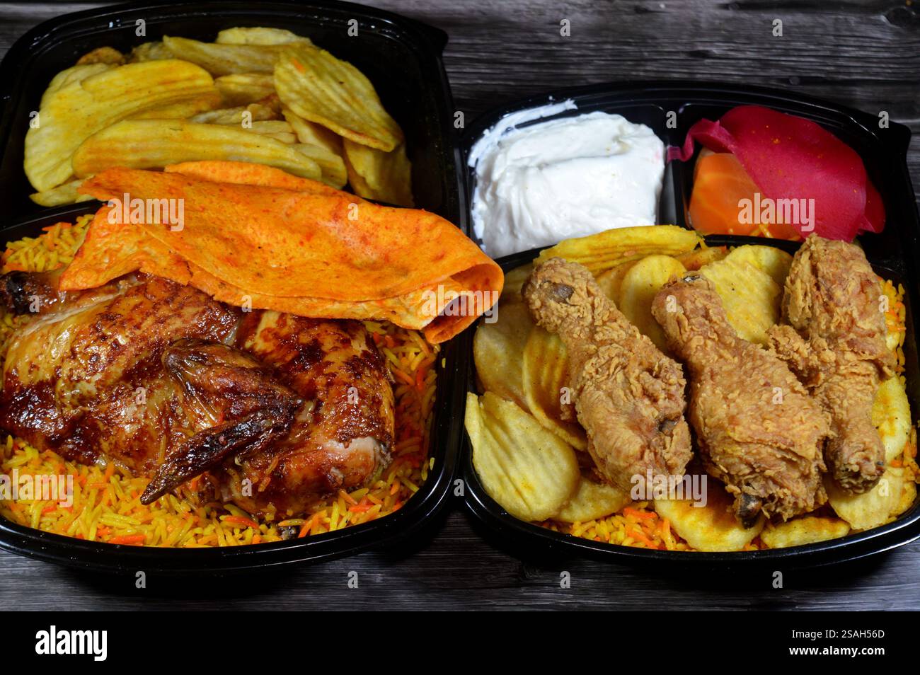 Syrian food of machine grilled barbecued chicken with colorful Basmati ...