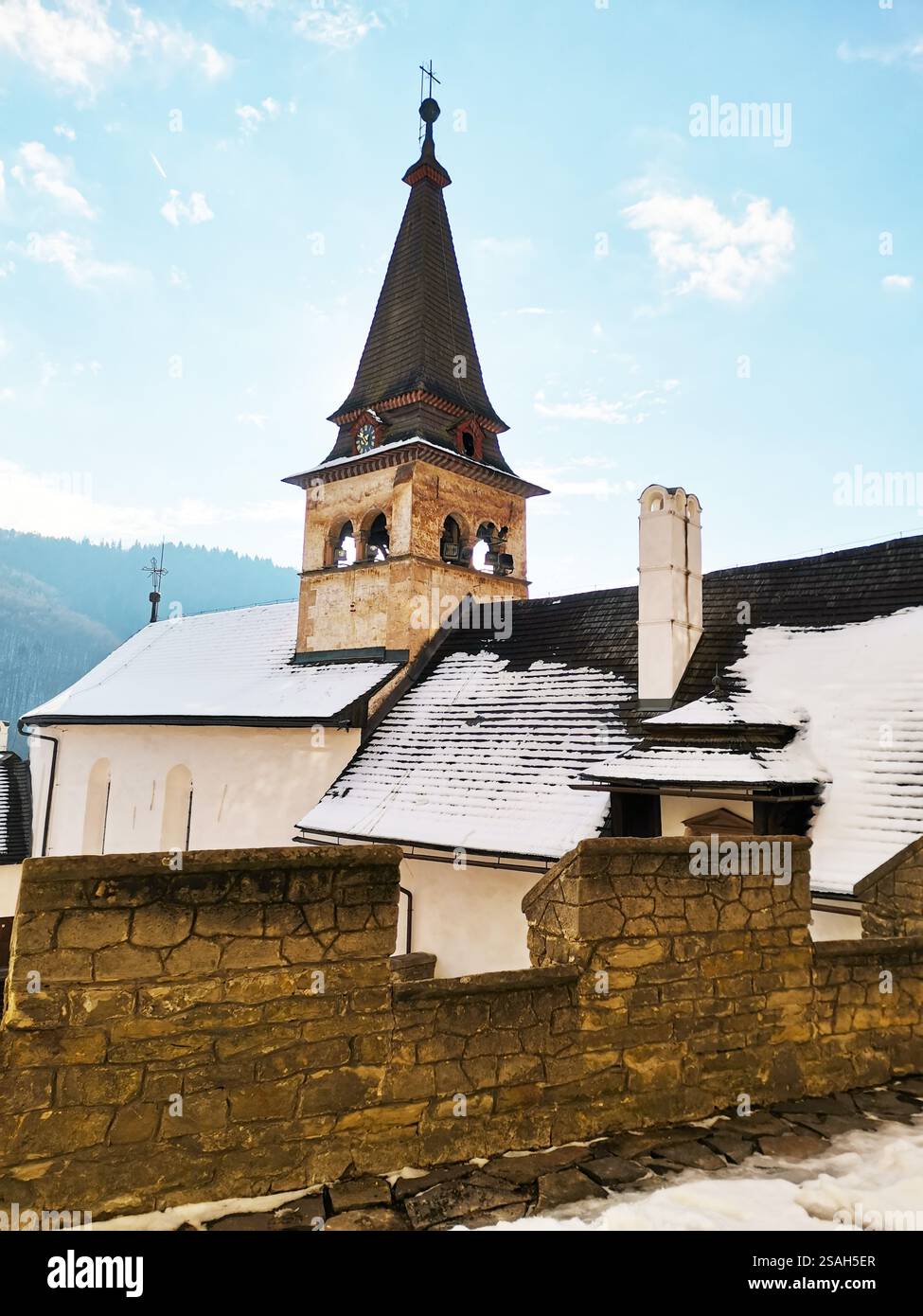 Church tower with cross in medieval castle Stock Photo - Alamy