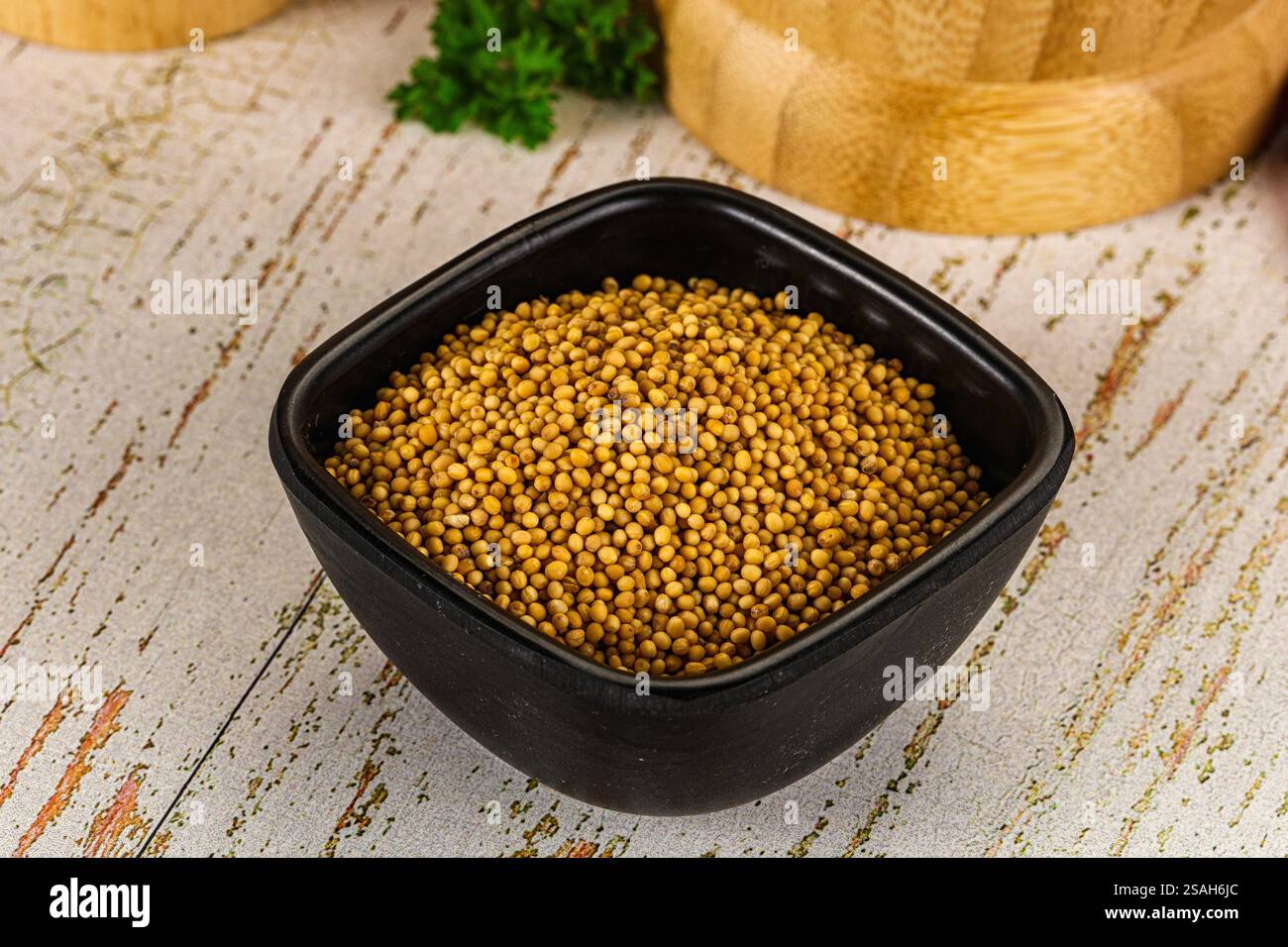 Dry mustard seeds in the bowl for culinary Stock Photo - Alamy