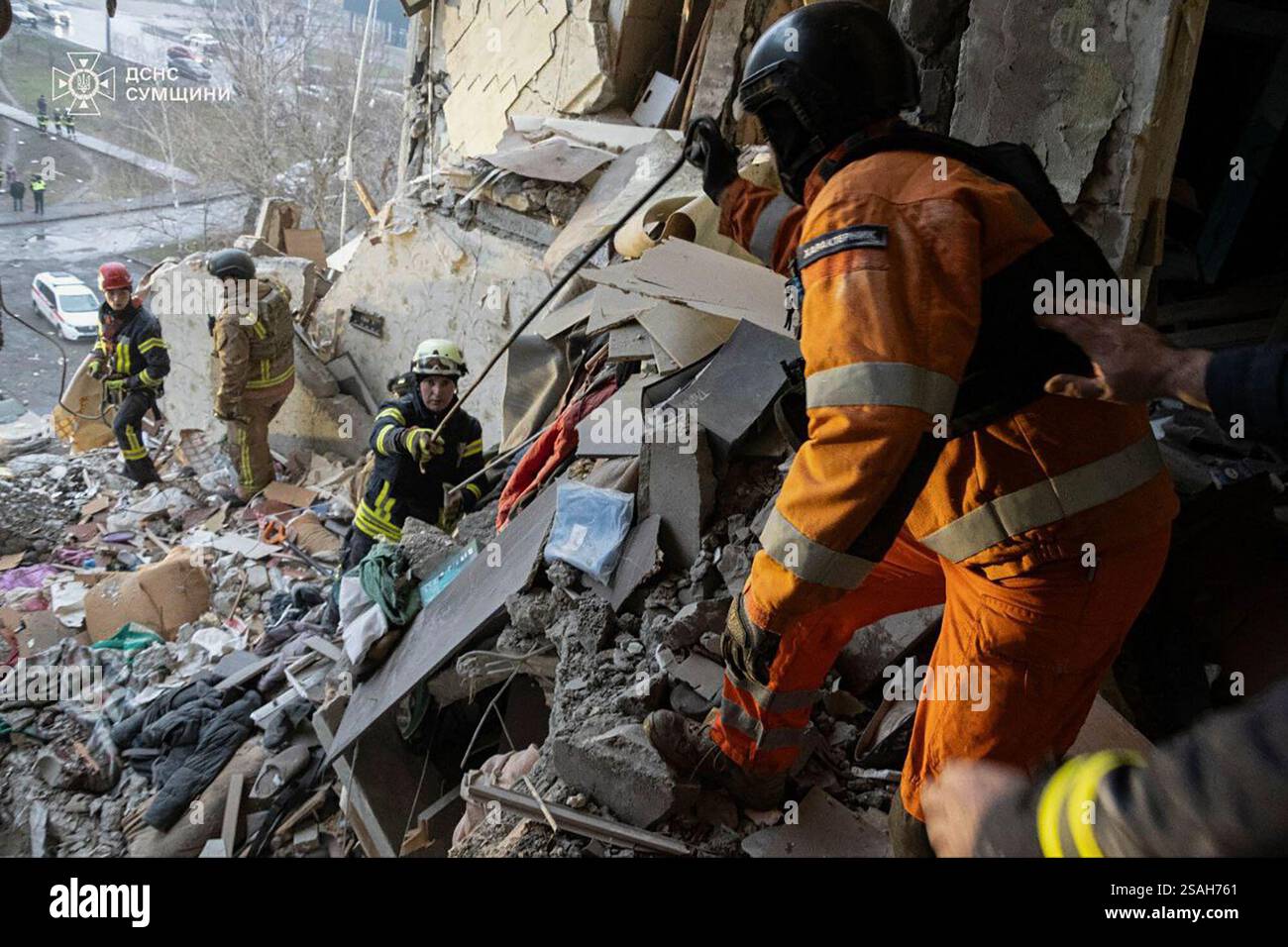 In this photo provided by the Ukrainian Emergency Service, rescuers ...
