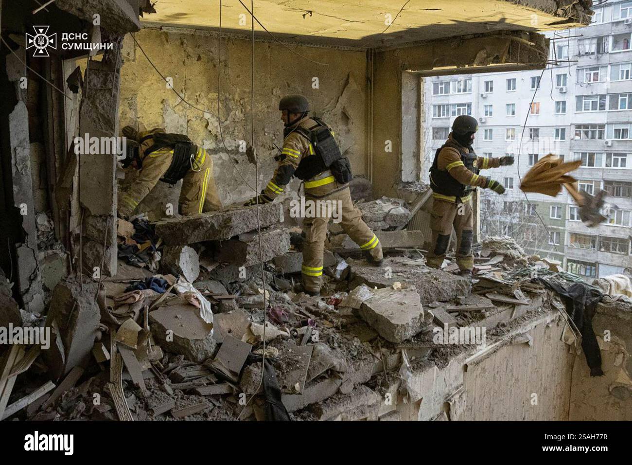 In this photo provided by the Ukrainian Emergency Service, rescuers ...