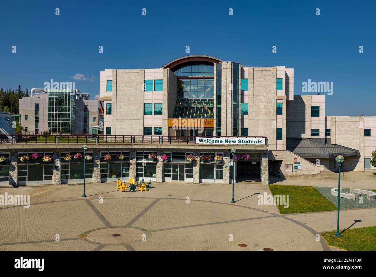 UNBC main building entrance with "Welcome New Students" banner ...