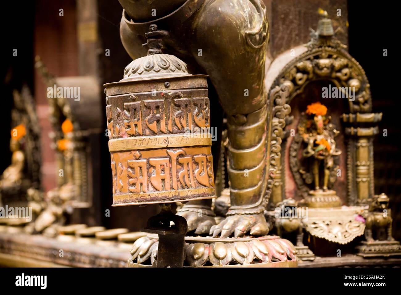 Bronze Tibetan prayer wheels or mani with the inscriptions in Sanskrit ...