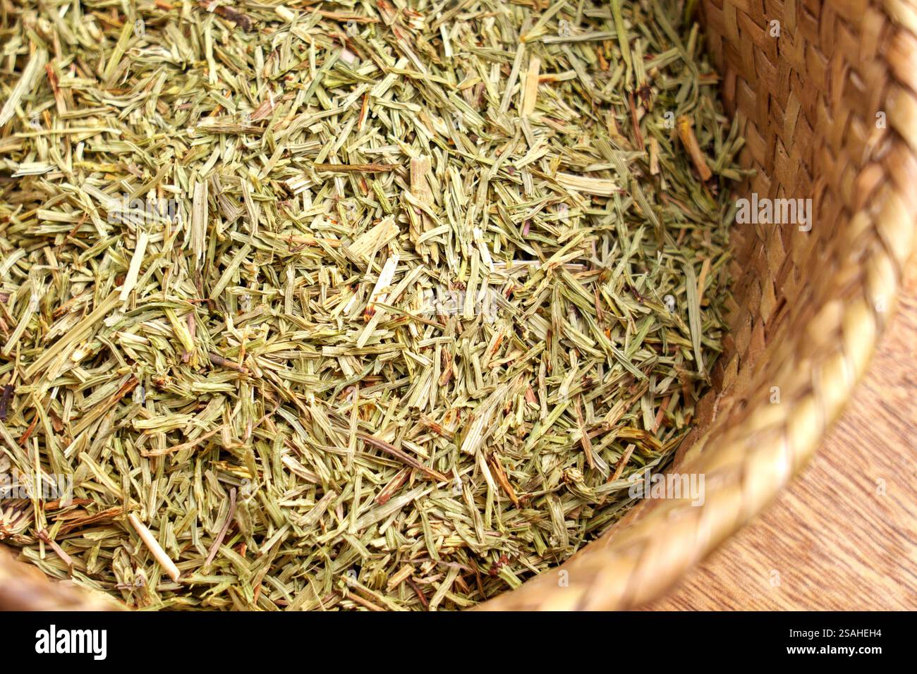 Medicinal dried horsetail herbs in woven basket. Top view. Natural ...