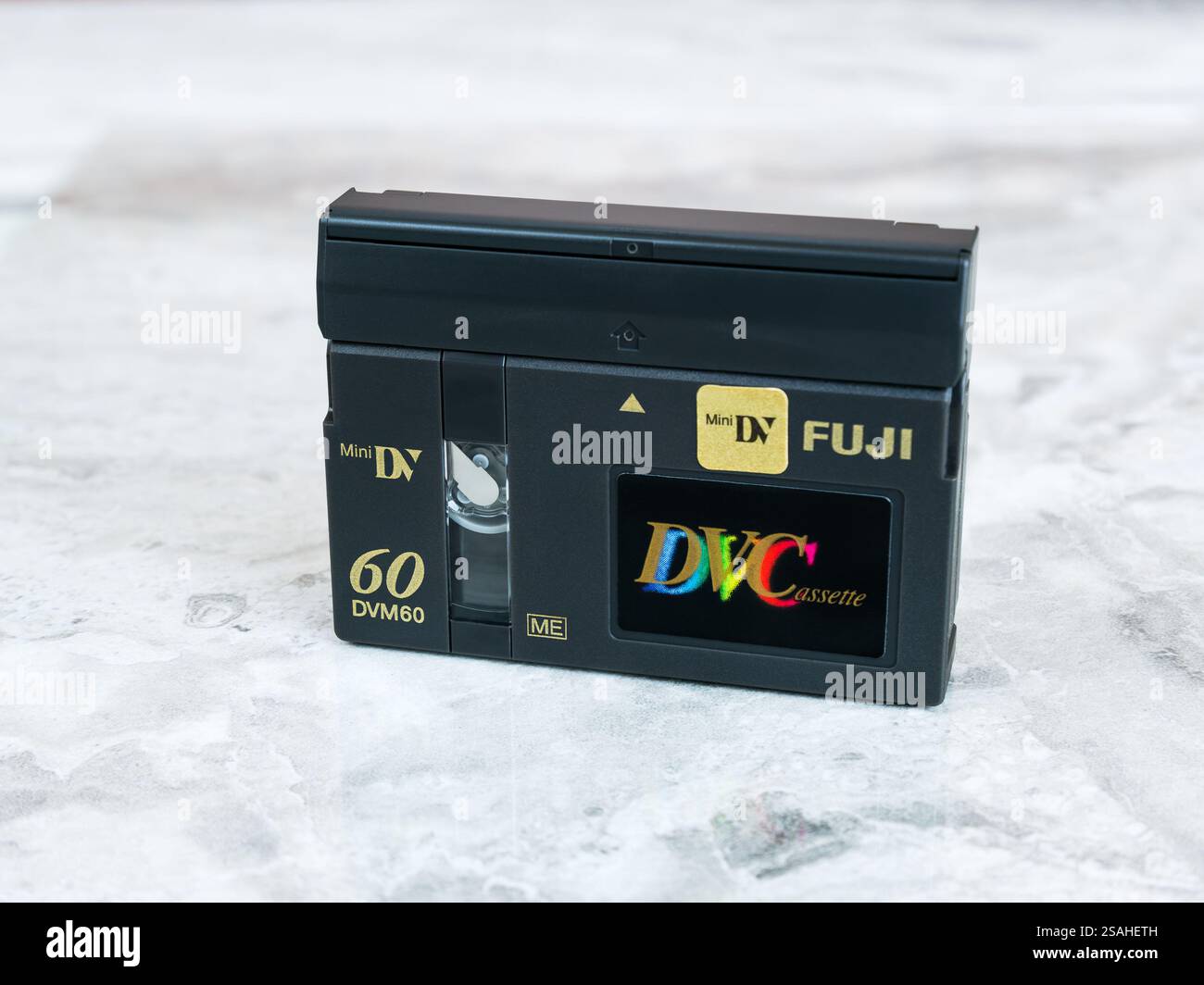 Mini DV digital video cassette Fuji DVM60 ME DVCasstte on a polished ...