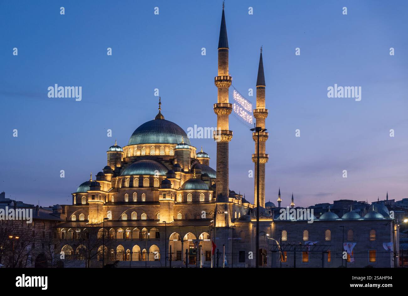 A historic mosque in Istanbul, Turkey, illuminated at twilight. The ...