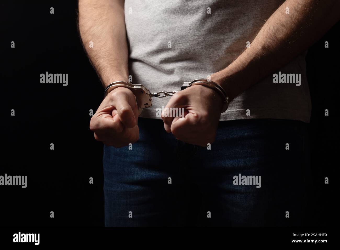 A criminal in handcuffs in front. Arrest for murder Stock Photo - Alamy