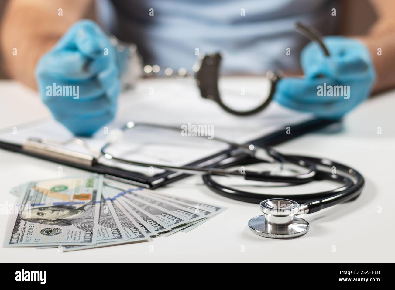 A doctor with dollar bank notes and handcuffs. concept of medical ...