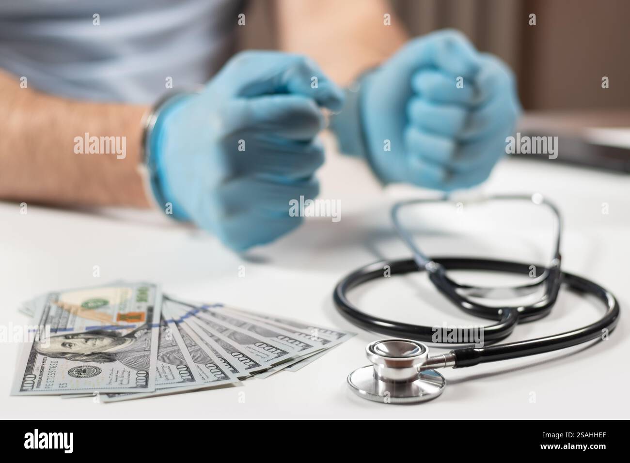 A doctor with dollar bank notes and handcuffs. concept of medical ...