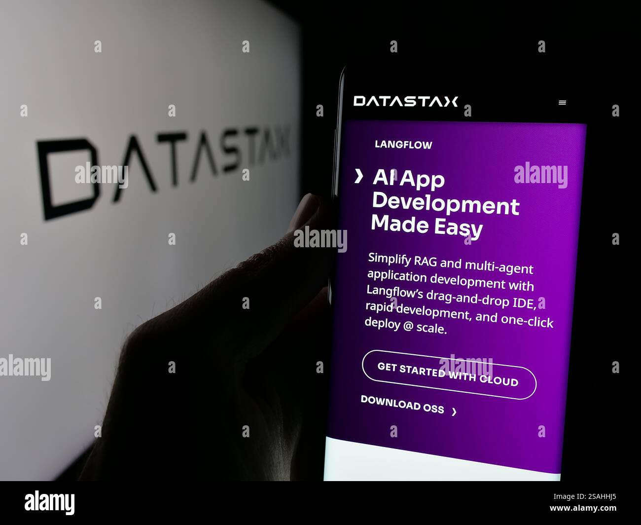 In this photo illustration, a person is holding a cellphone with the ...