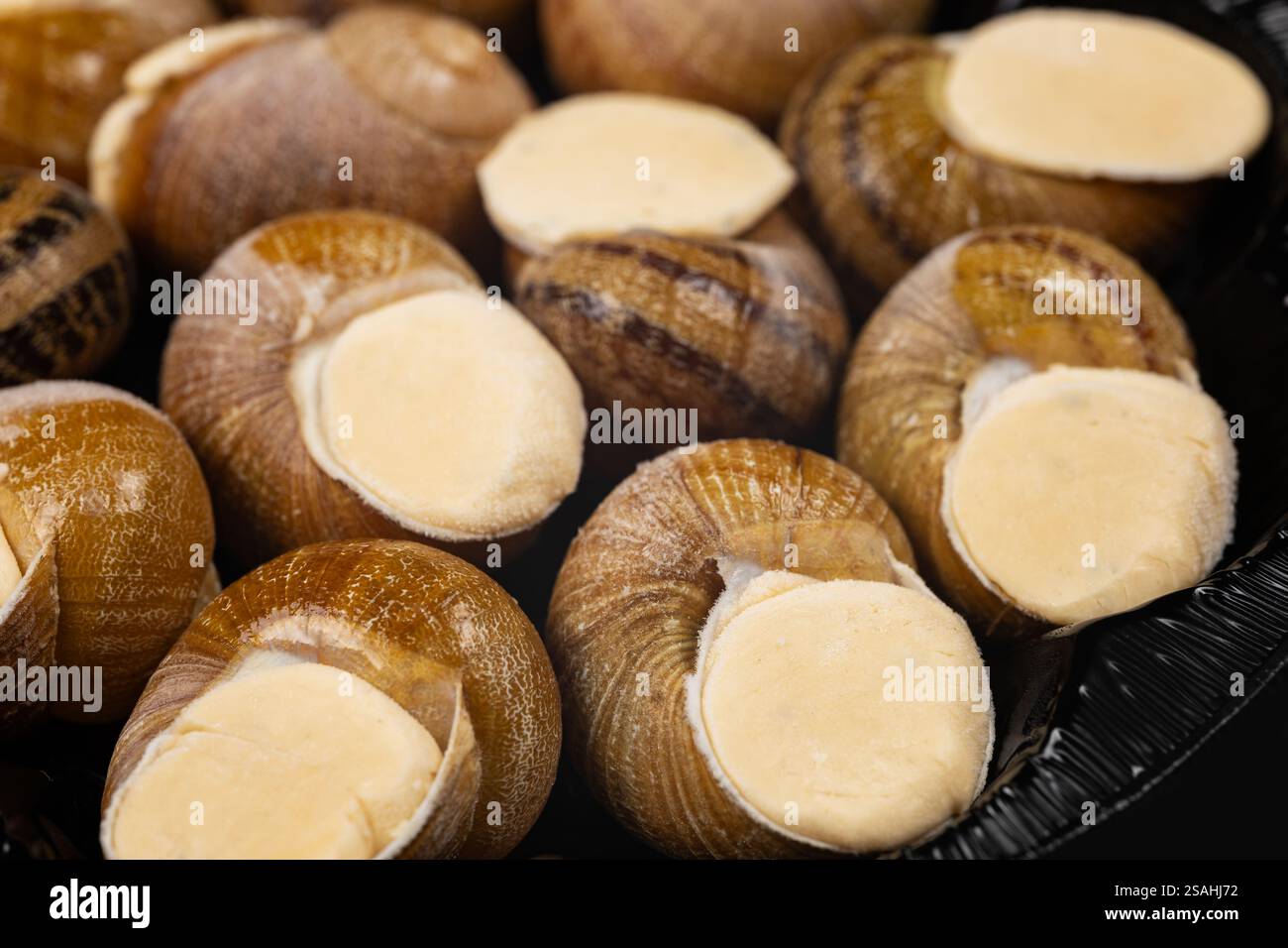 frozen snails in the supermarket as a texture Stock Photo - Alamy