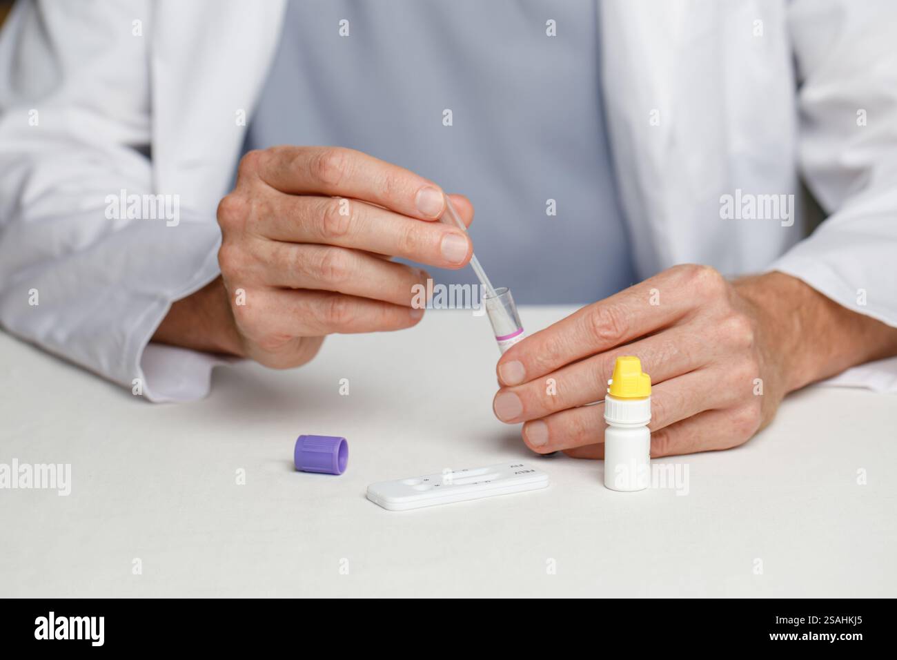 Male veterinarian practitioner doing medical sample rapid diagnostic ...